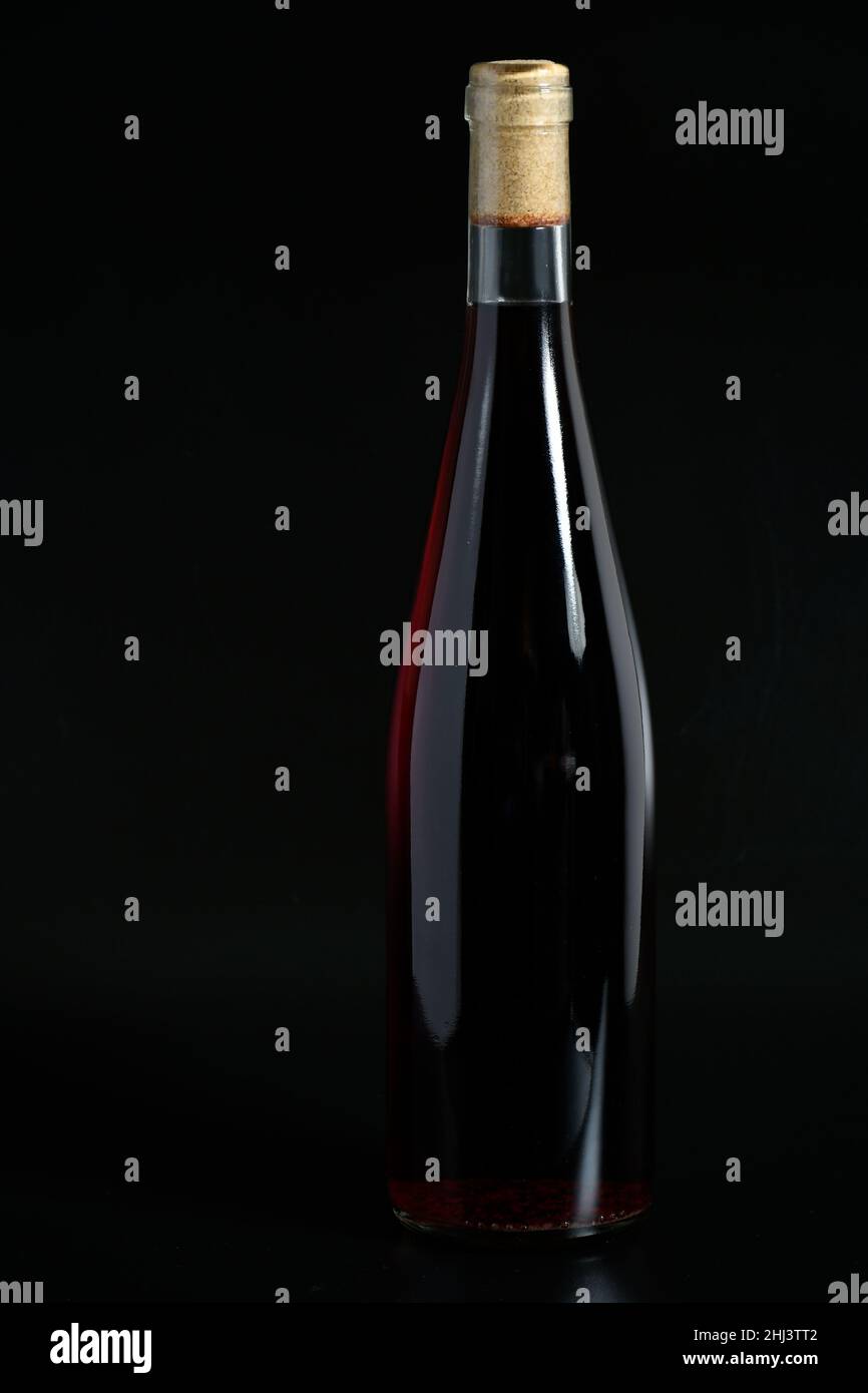 bottle of red wine black background Stock Photo - Alamy