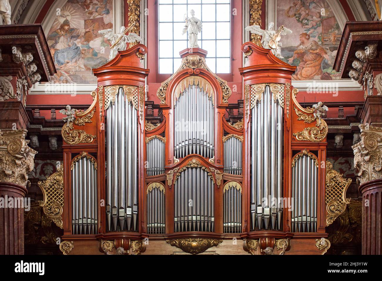 The organ in the Baroque parish church in Poznan, Poland. Fragment of ...