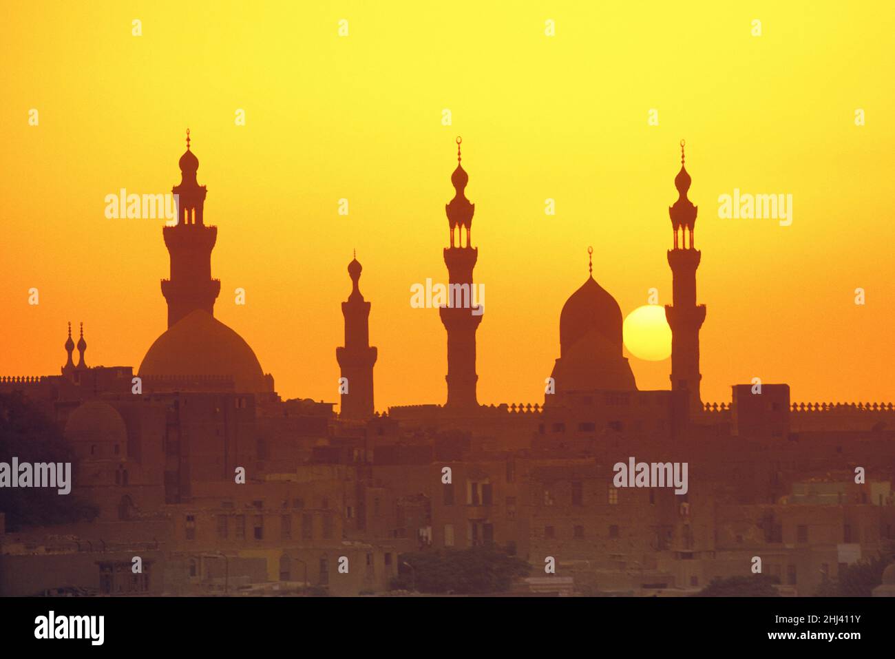 Silhouettes of the Sultan Hassan and Al-Rifai Mosques at Sunset, Cairo ...