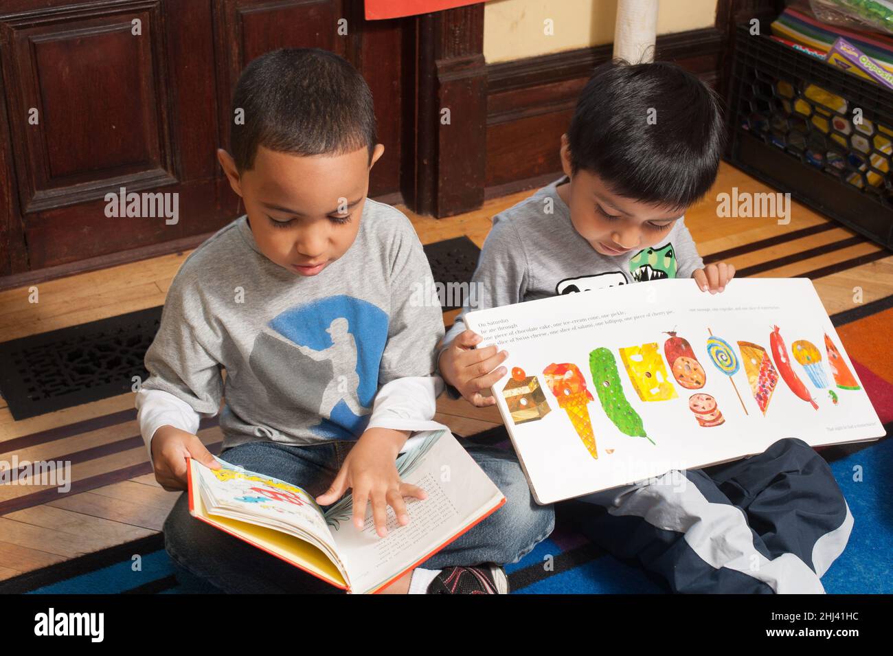 Child k 3 reading book hi-res stock photography and images - Alamy