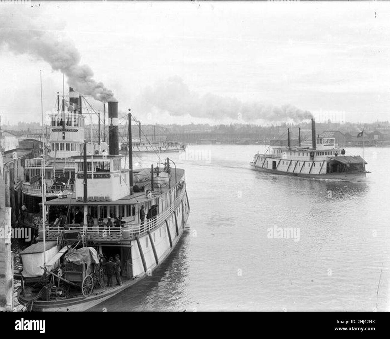 Sternwheelers TAHOMA and BAILEY GATZERT carrying passengers and freight ...