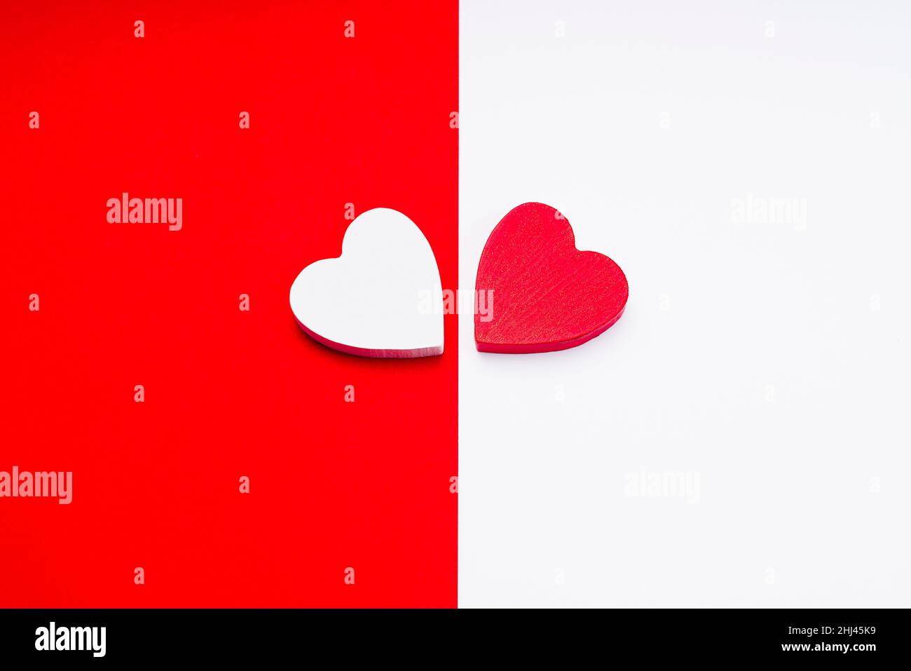 Two hearts red and white on a mixed background white and red.Template ...