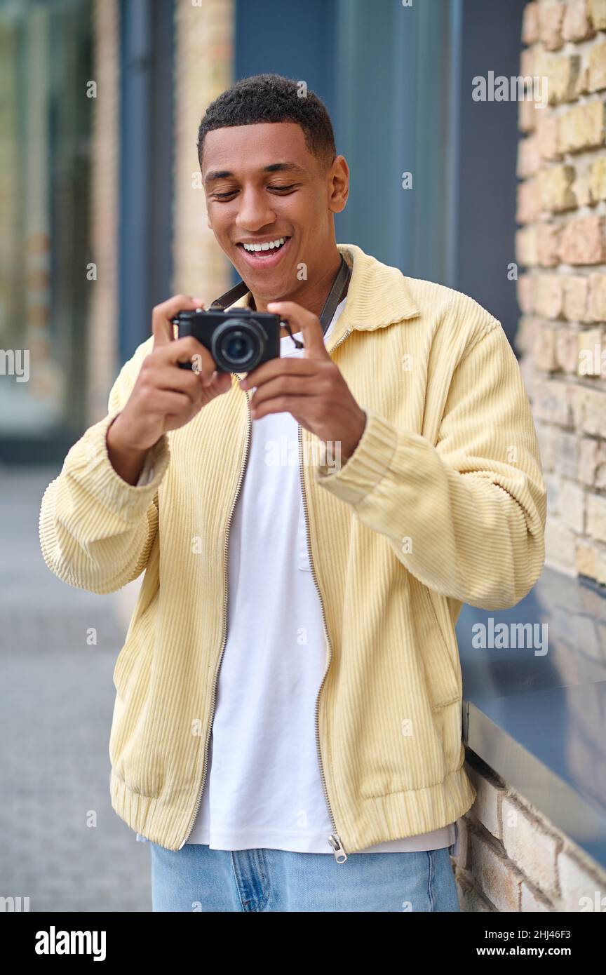 Man standing outdoors looking at camera Stock Photo - Alamy