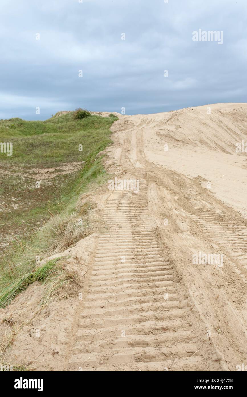 Coastal sand dunes recently scraped clear of vegetation by the Sands of ...