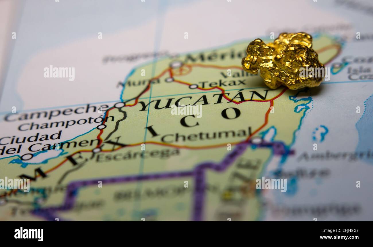 Close-up of a gold-nugget on top of a map of Mexico Stock Photo - Alamy