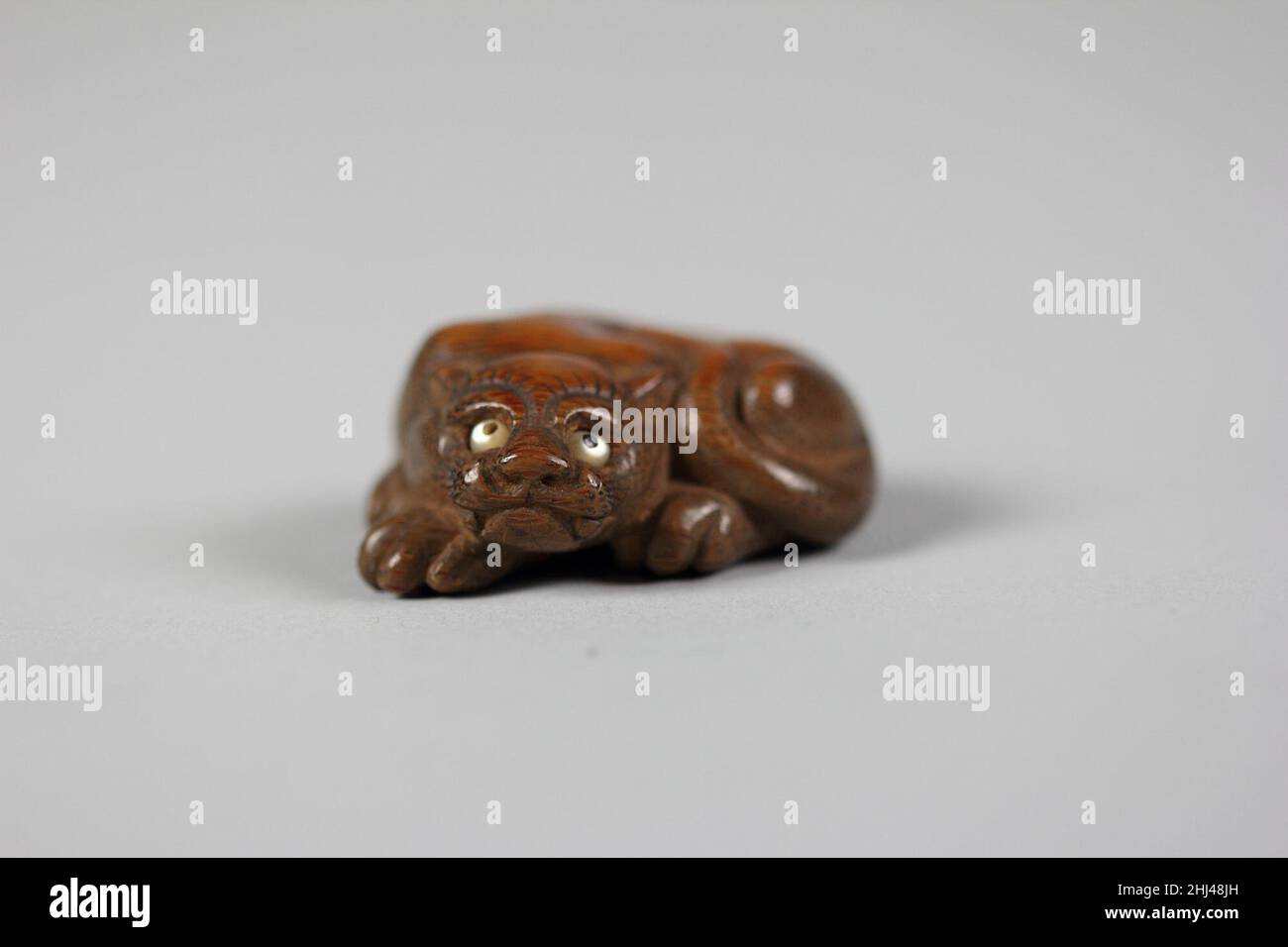 Netsuke of Recumbent Tiger 19th century Japan. Netsuke of Recumbent ...