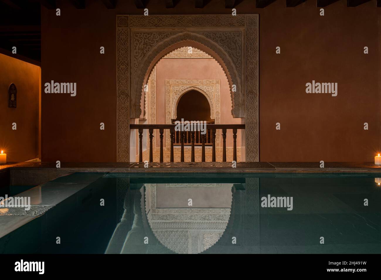 Hot water bath in darkness with reflection on the surface of the Arab ...