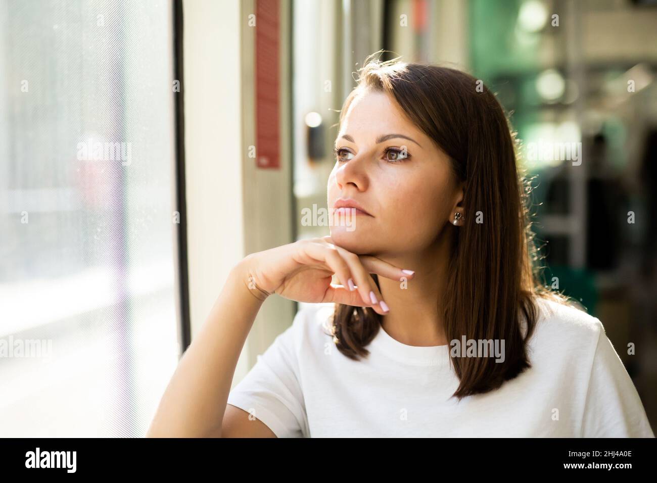 Female passenger in public land transport Stock Photo - Alamy