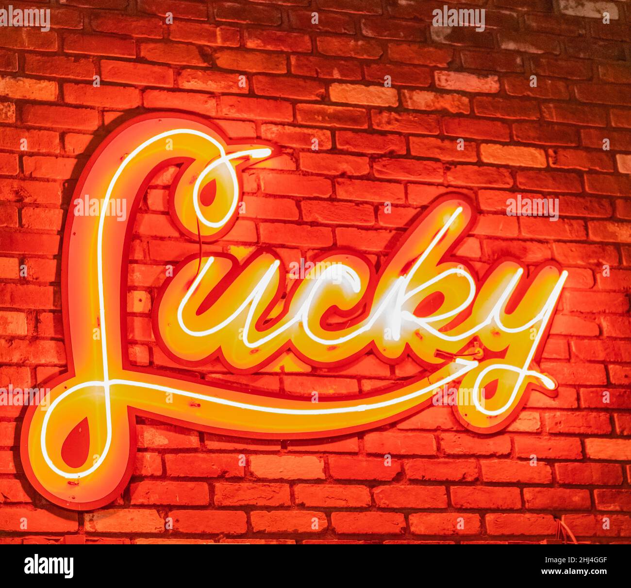 Neon sign Lucky Light banner, glowing neon on brick wall. Illustration ...