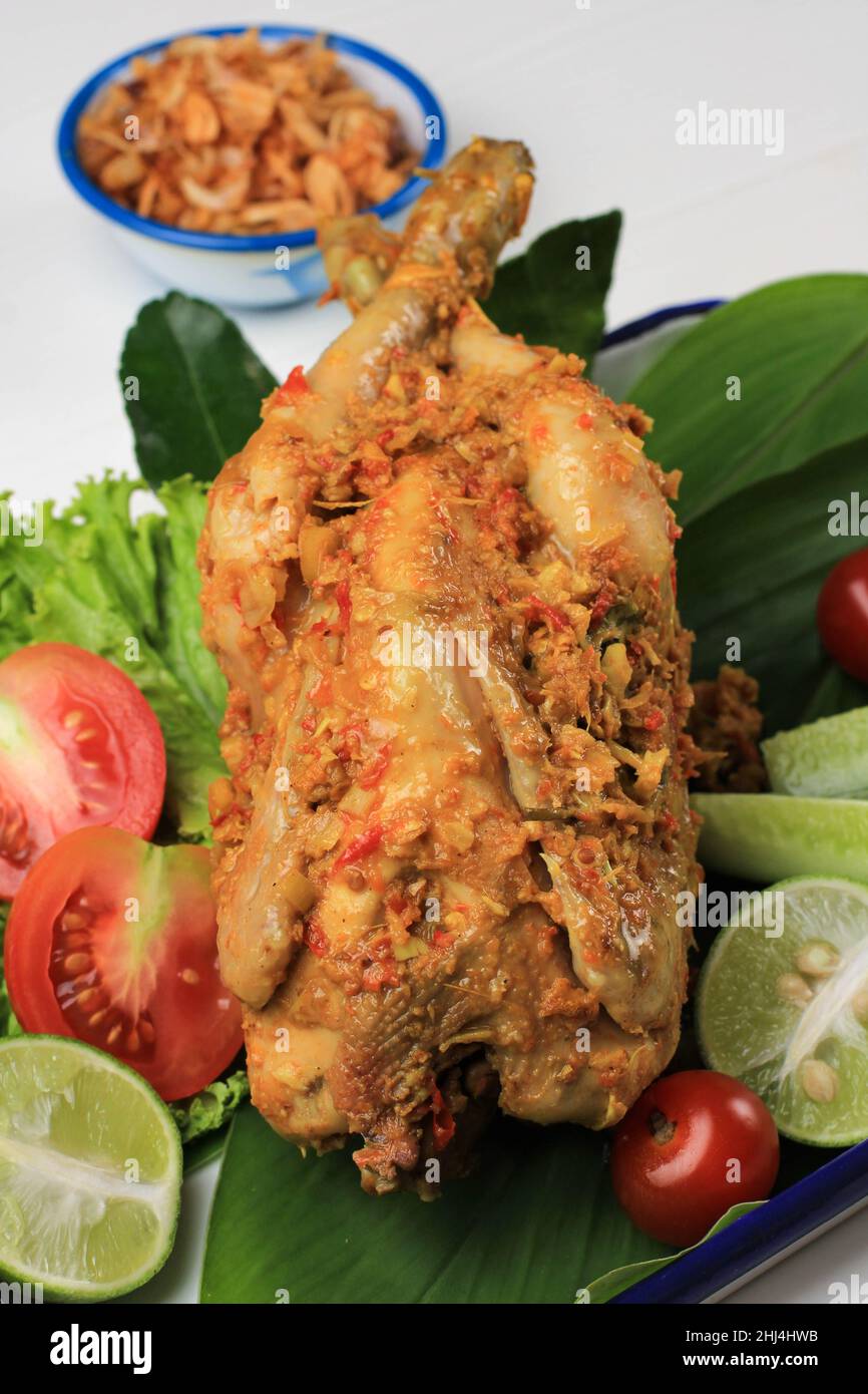 Ayam Betutu. Balinese Roast Chicken Stuffed with Cassava Leaves Stock ...