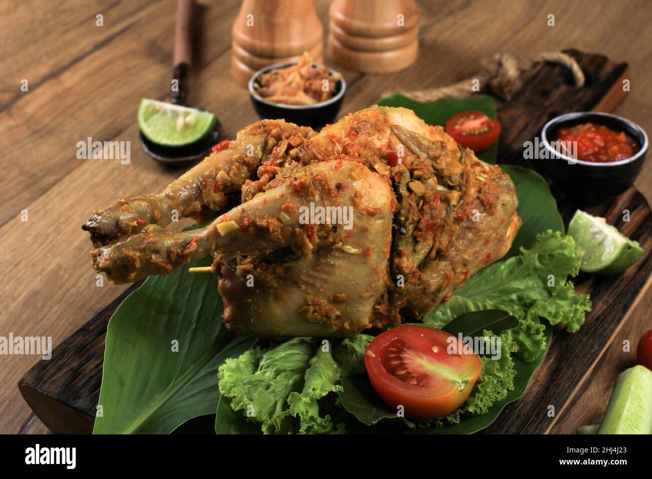 Ayam Betutu. Balinese Roast Chicken Stuffed with Cassava Leaves Stock ...