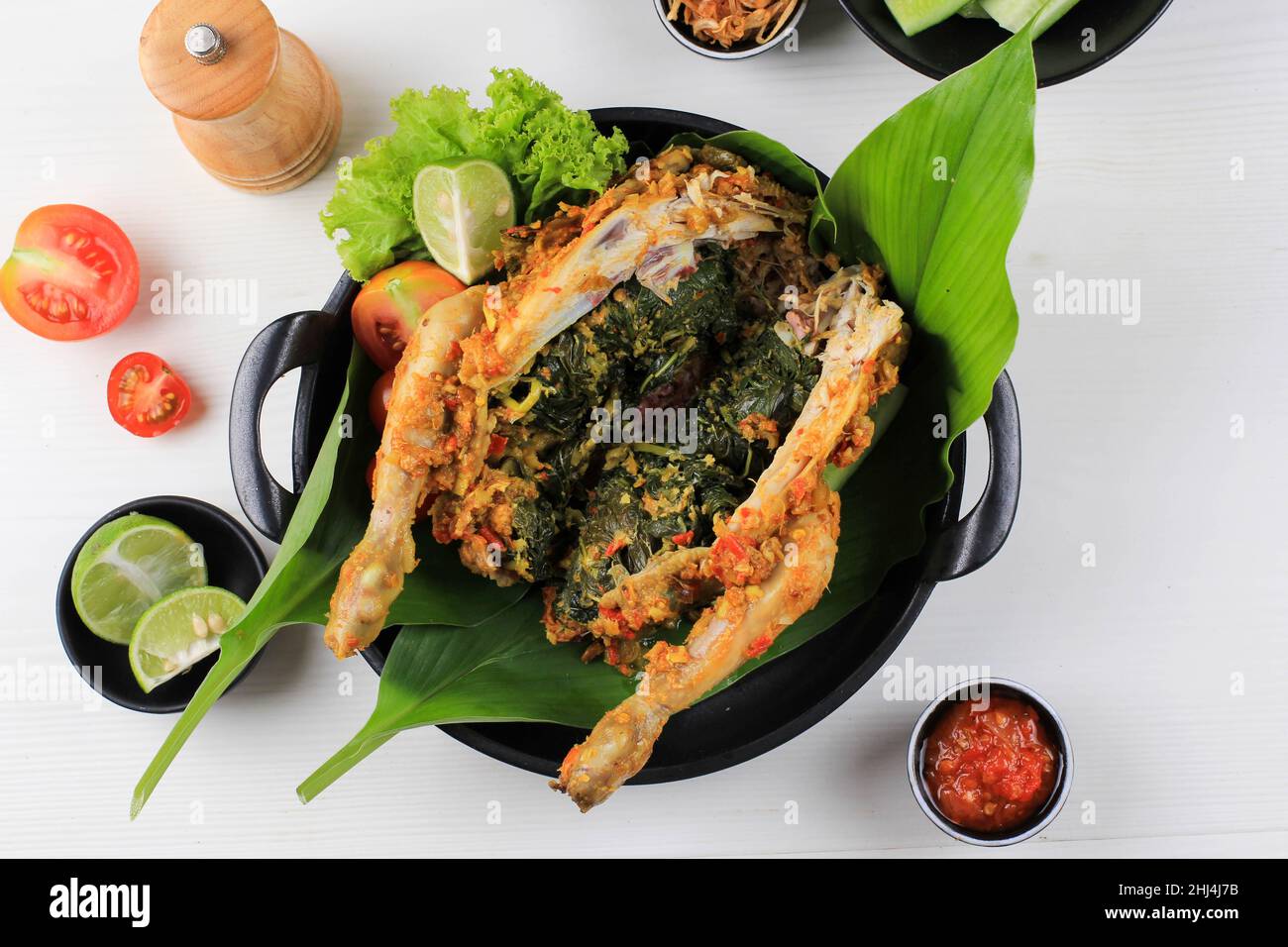 Ayam Betutu. Balinese Roast Chicken Stuffed with Cassava Leaves Stock ...