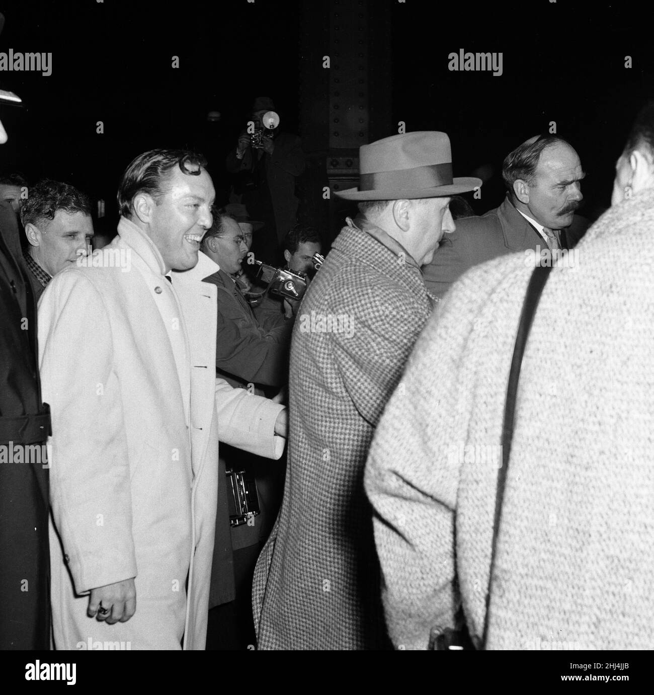 American rock and roll singer Bill Haley waves as he arrives in London ...