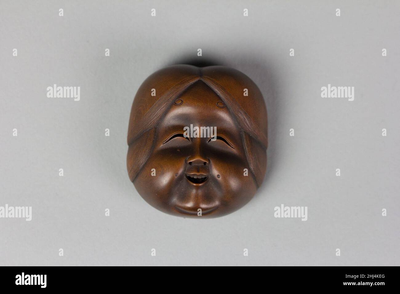 Netsuke okame hi-res stock photography and images - Alamy