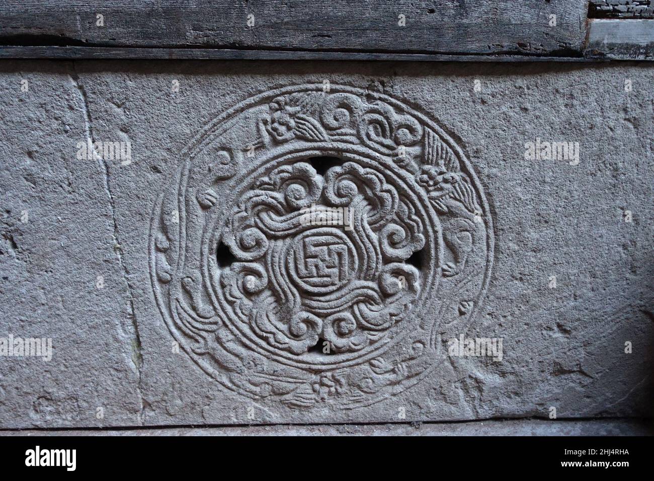 Stonework swastika - Yin Yu Tang House Stock Photo - Alamy