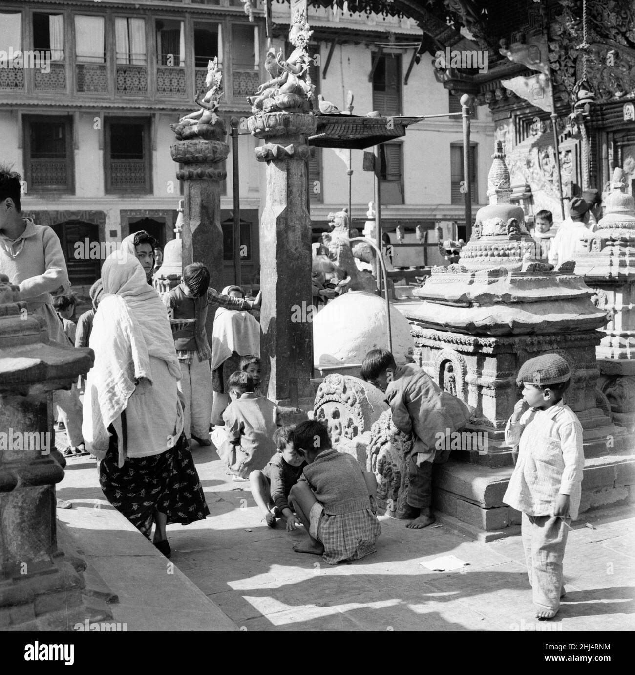 Nepalese children playing around the Changnarayan Temple in Katmandu ...