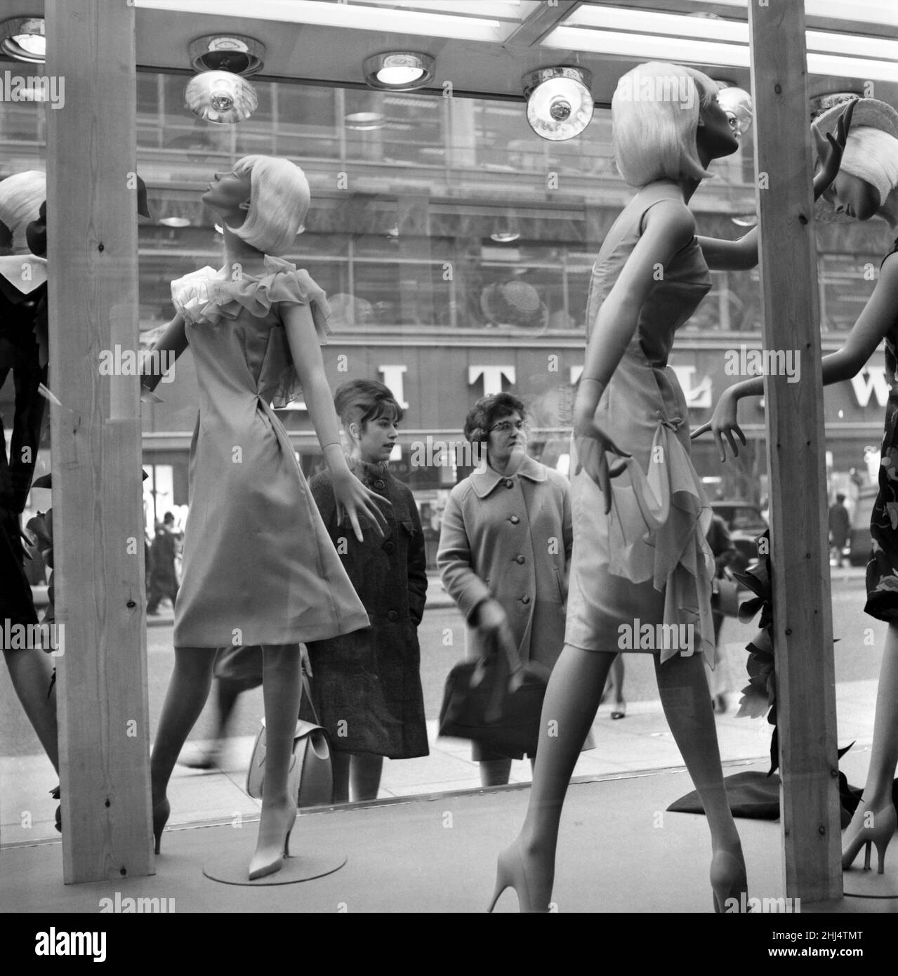 Who's the dummy? Window shopping in Oxford Street, London. Circa 1960 ...