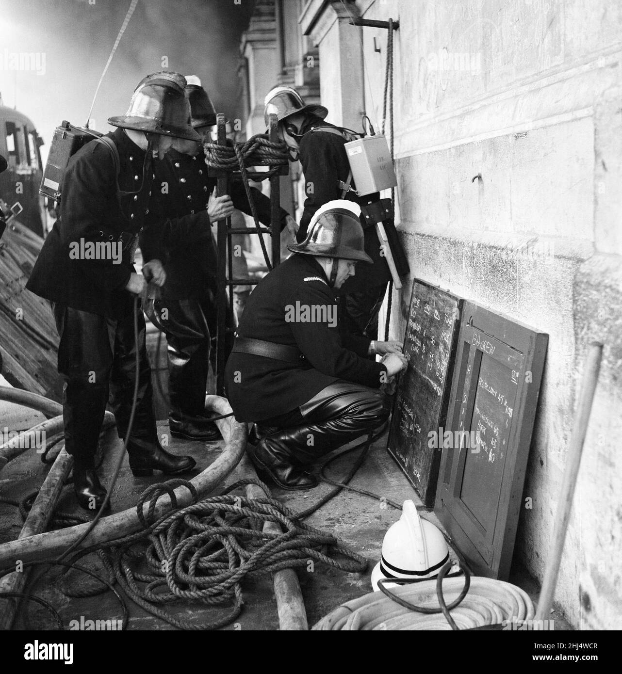 Firefighters attend the scene of a fire which broke out at Smithfield ...