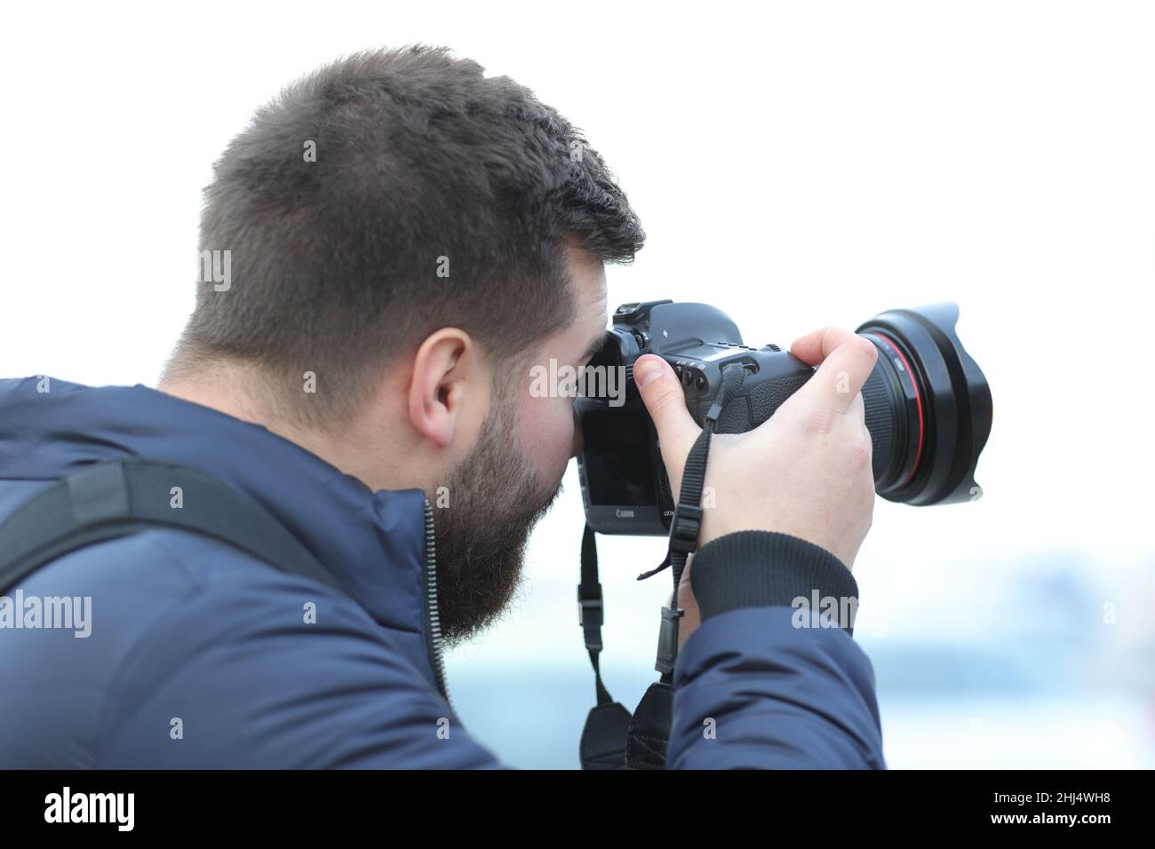 Male photographer using a professional camera outdoors Stock Photo - Alamy