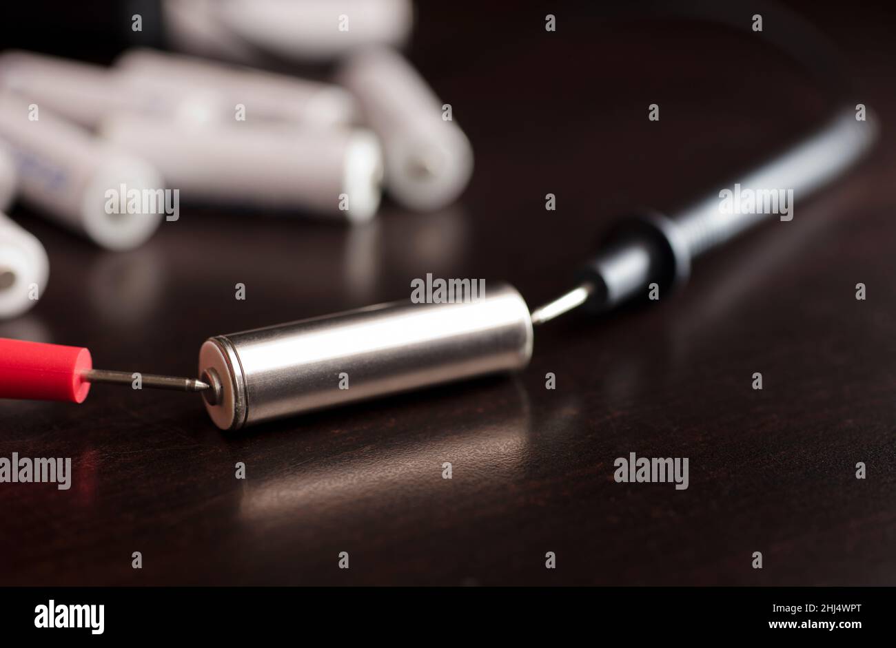 battery, volt meter, red positive pole, black negative pole, on work ...