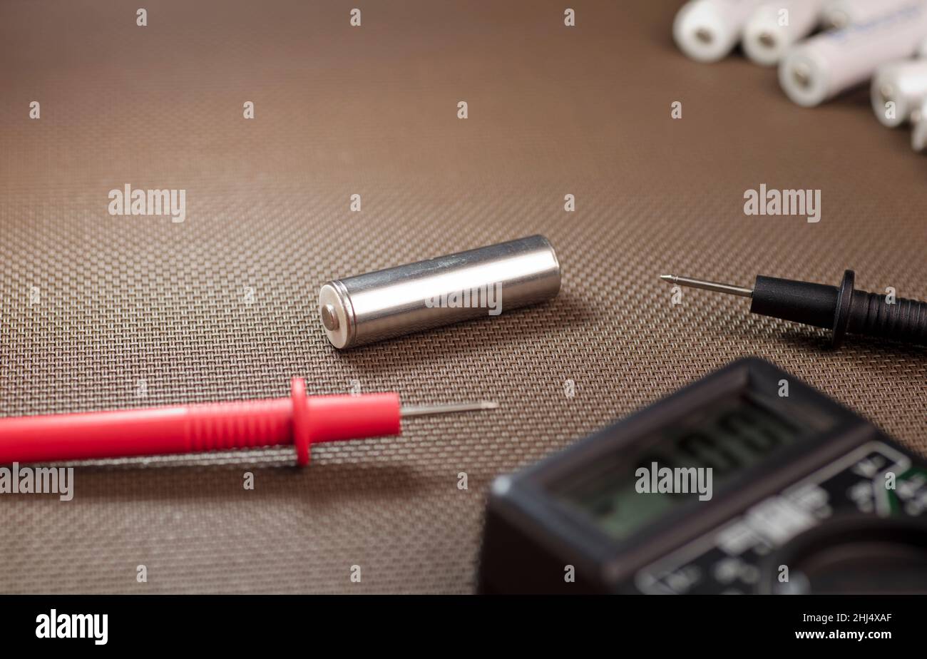 battery with volt calculator, voltmeter, multimeter red positive pole ...