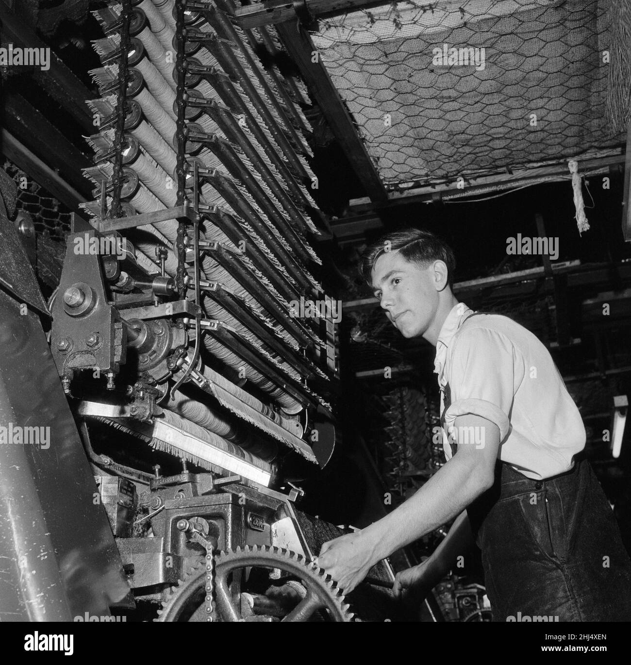 Robert Howarth aged 17 working at Crossleys factory. Halifax in West ...