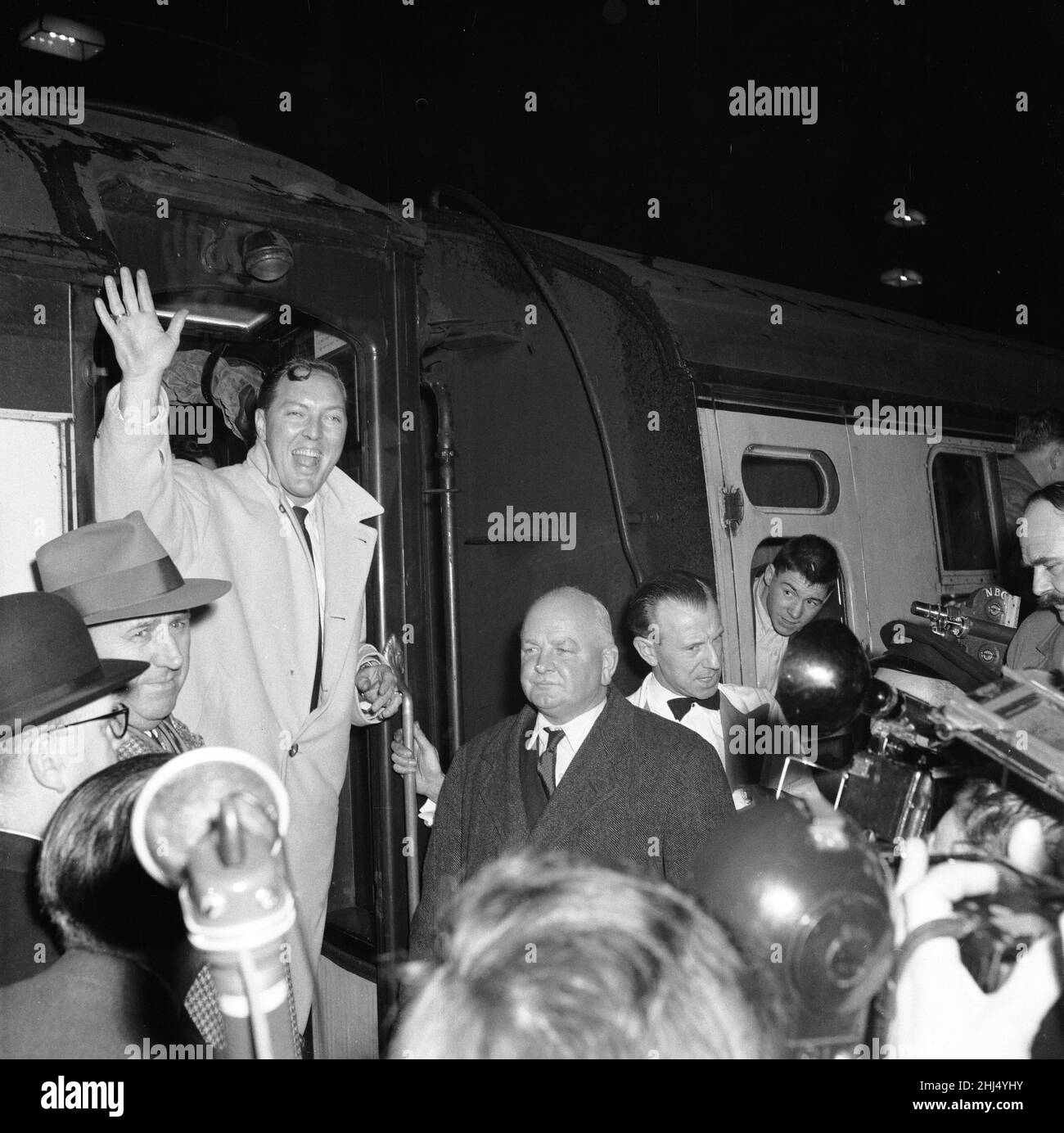 American rock and roll singer Bill Haley waves as he arrives in London ...