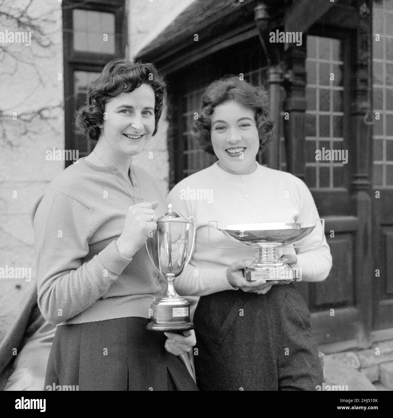 British racing drivers Pat Moss and Ann Wisdom celebrate with the ...