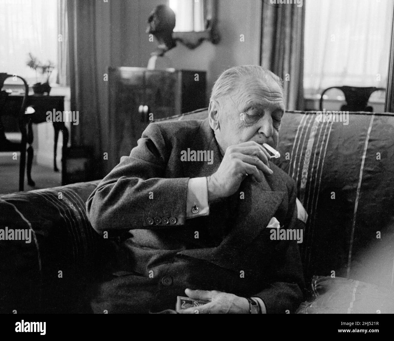 British writer William Somerset Maugham photographed smoking a ...