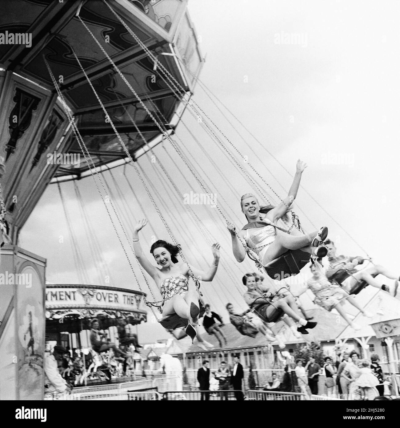 Beauty contest girls at Clacton Butlins on a fairground ride. Clacton ...