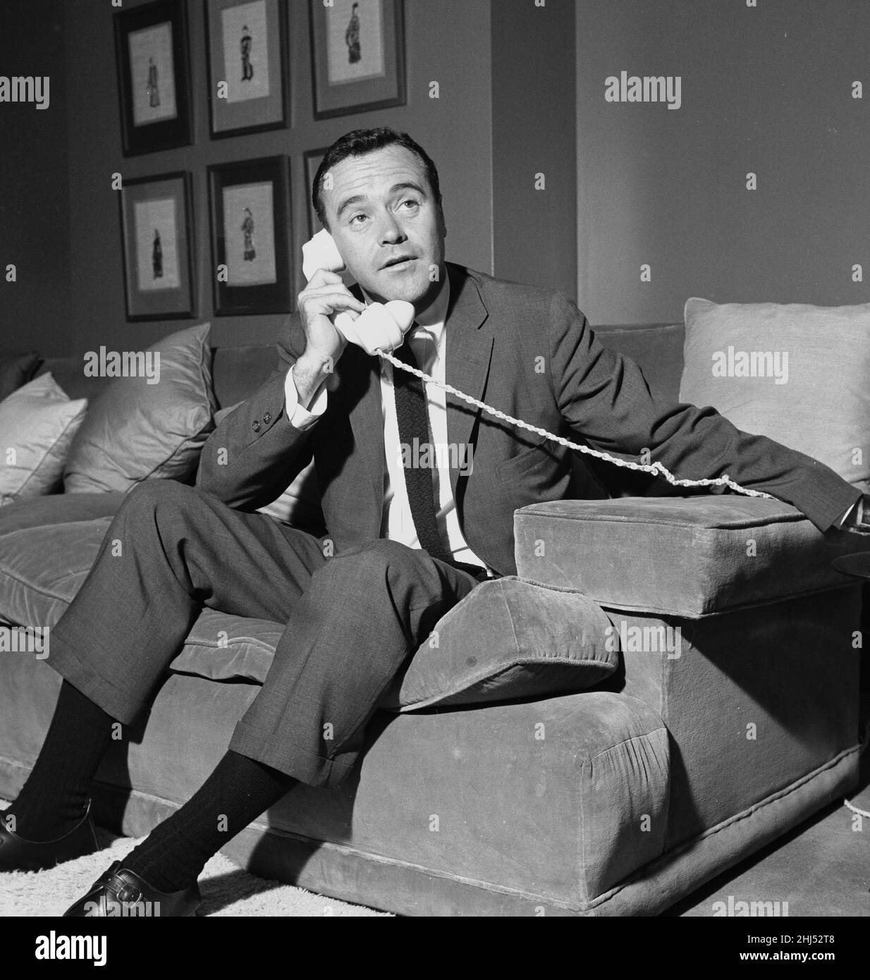 American actor Jack Lemmon on the telephone in his room at the Mayfair ...