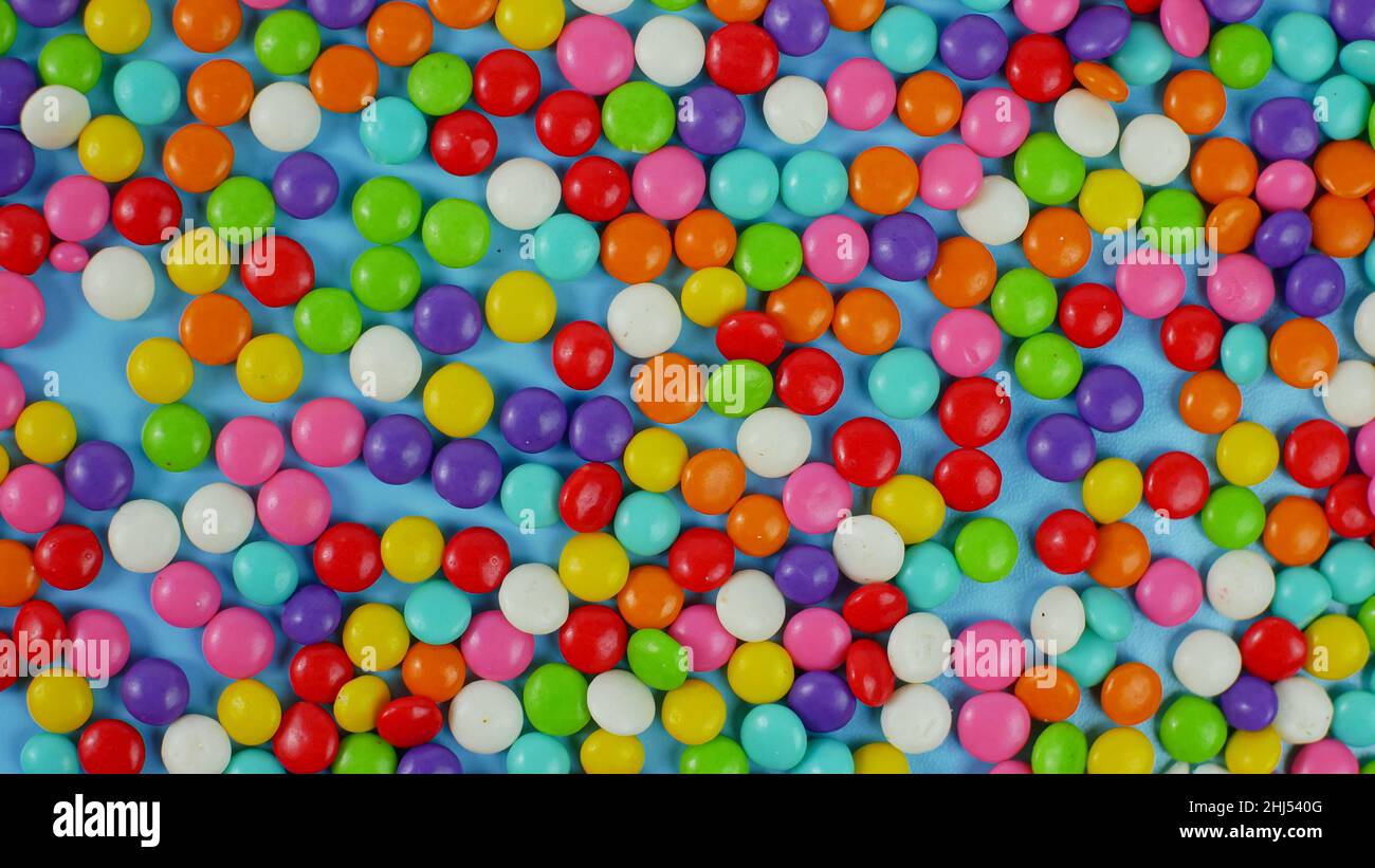colorful sweet candy balls on blue pastel background. trendy color for ...