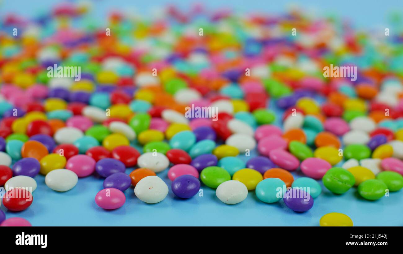 colorful sweet candy balls on blue pastel background. trendy color ...