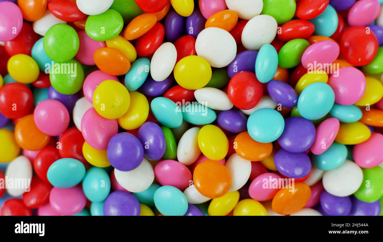 colorful sweet candy balls on blue pastel background. trendy color for ...