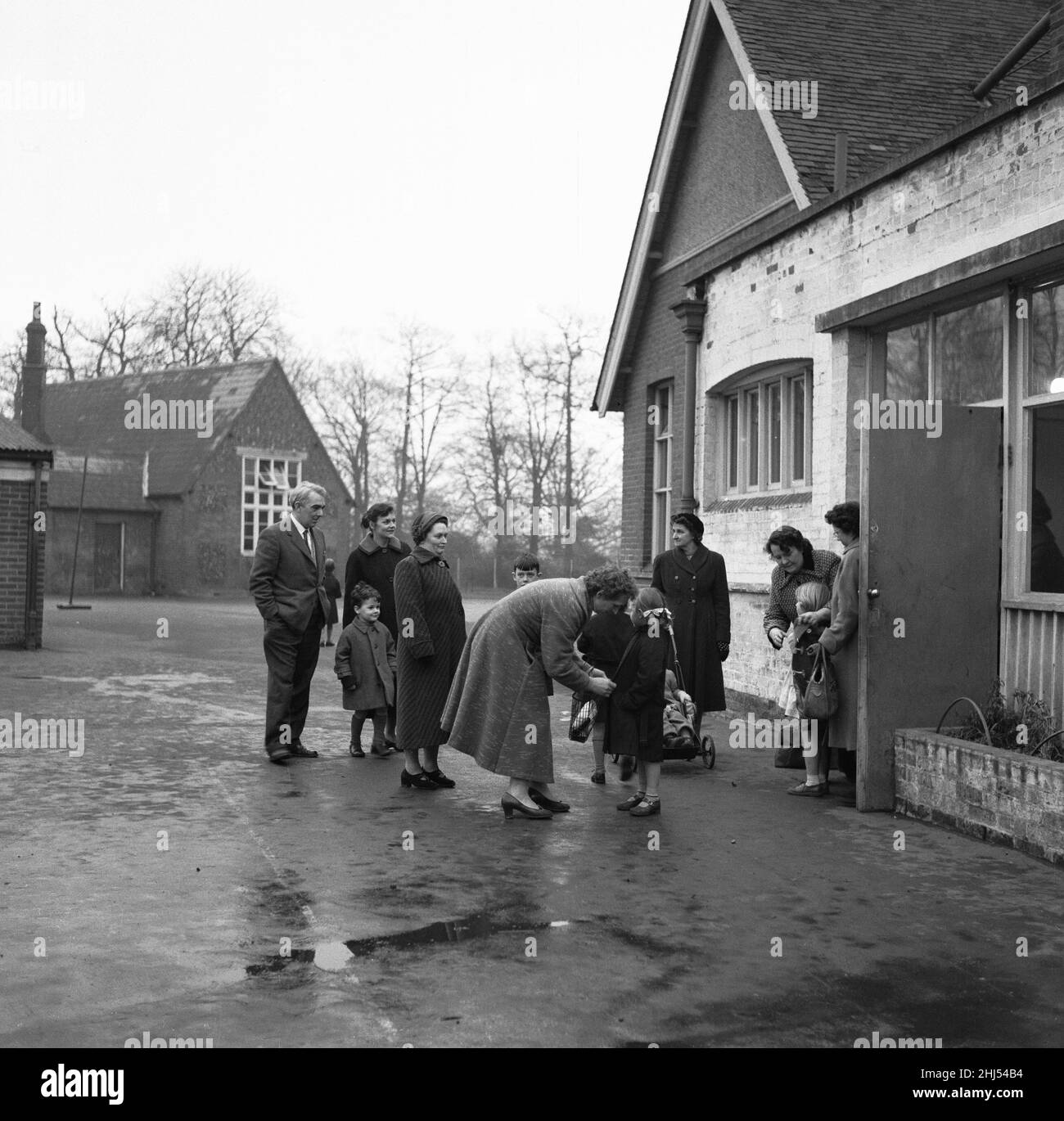 Parents collecting their children from school. 6th December 1957 Stock ...