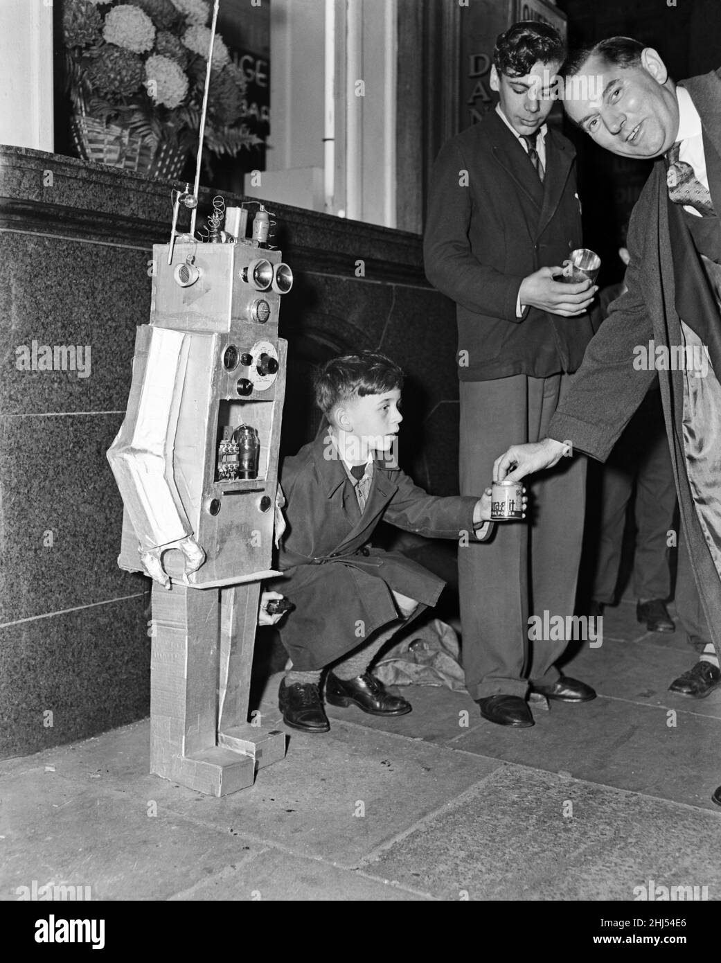 A young boy with a robot guy. 8th October 1957 Stock Photo - Alamy