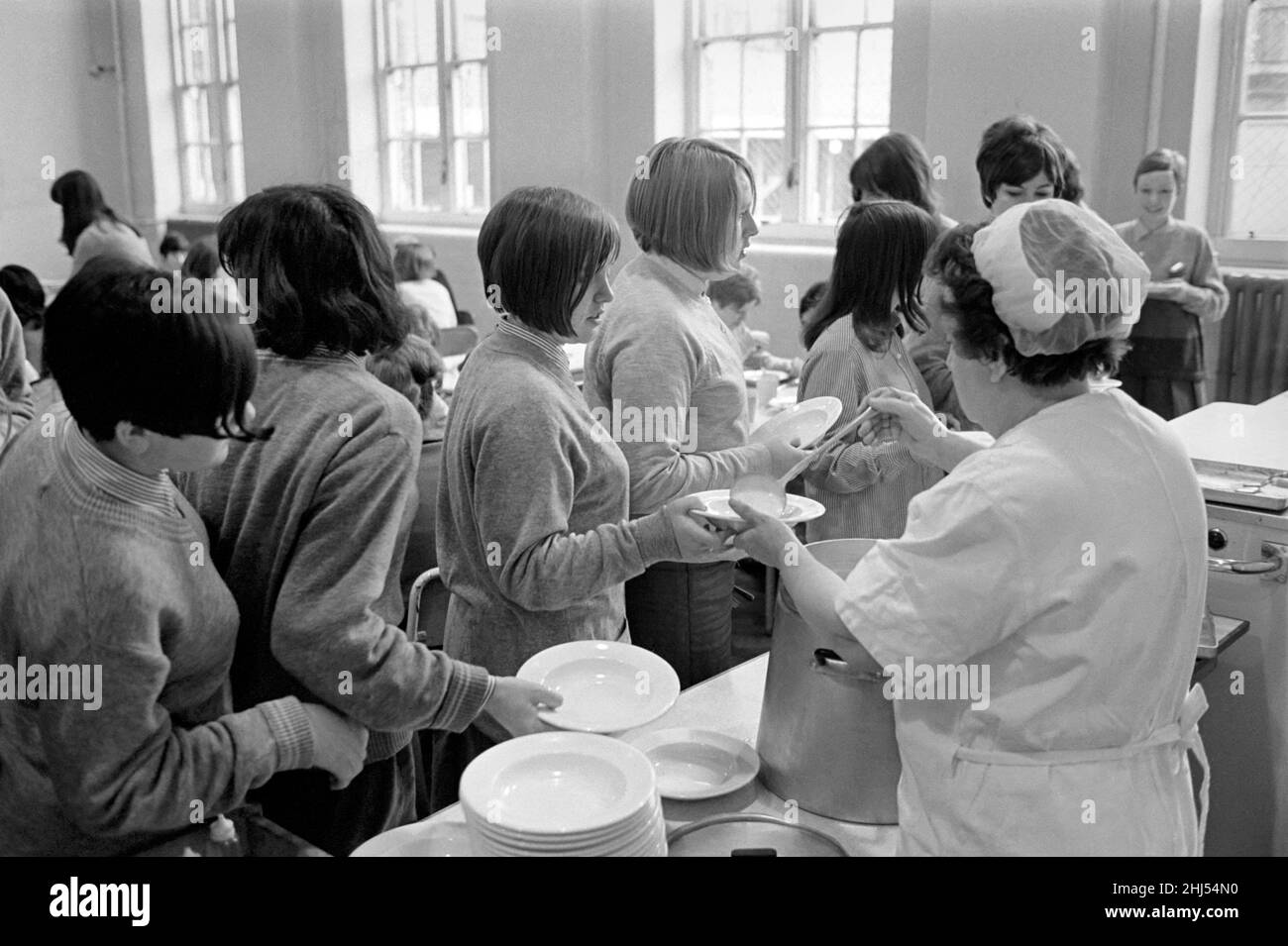 School Dinners. General scenes of school dinner. Ladies serving meal to ...