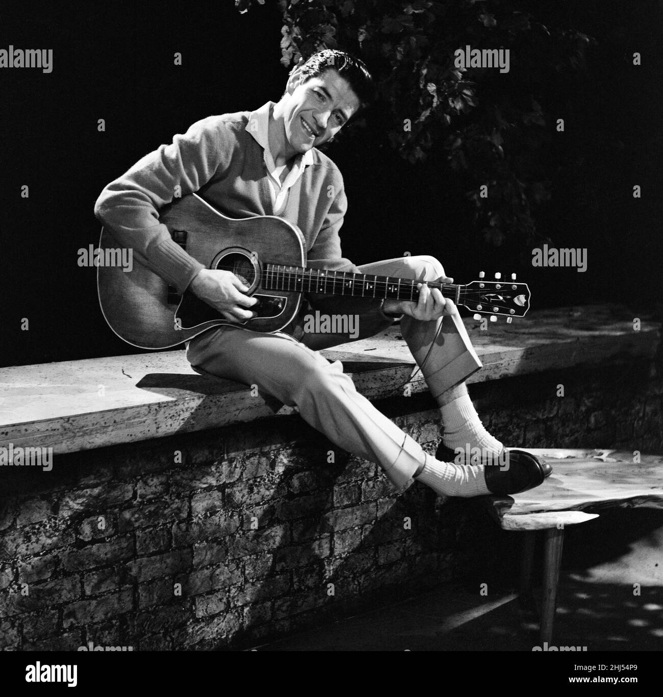 Singer Michael Holliday poses with guitar. 26th September 1958 Stock ...