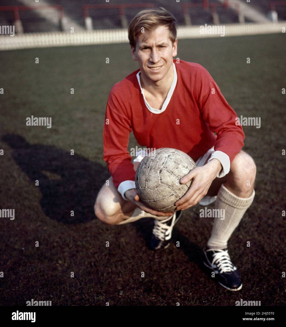 Manchester United footballer Bobby Charlton in his club strip, aged ...