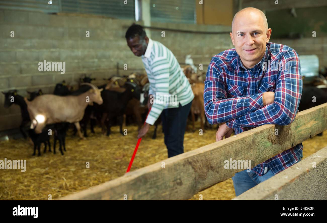 Portrait of man goat breeder Stock Photo - Alamy