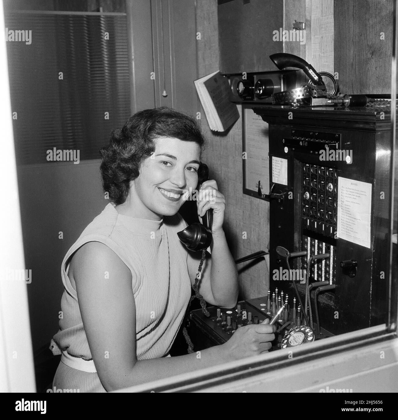Mrs Norma Whitehouse aged 25, telephonist at Kumficar. Halifax in West ...