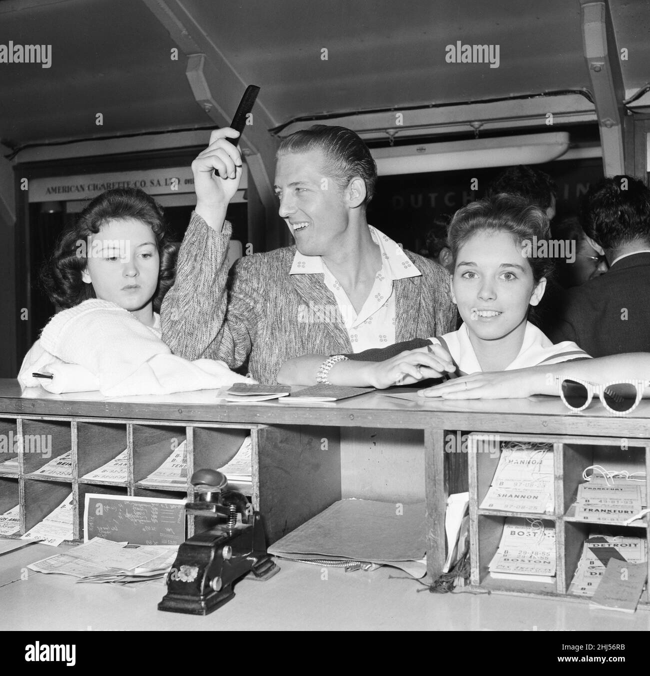 American rock and roll singer Jerry Lee Lewis signs immigration cards ...