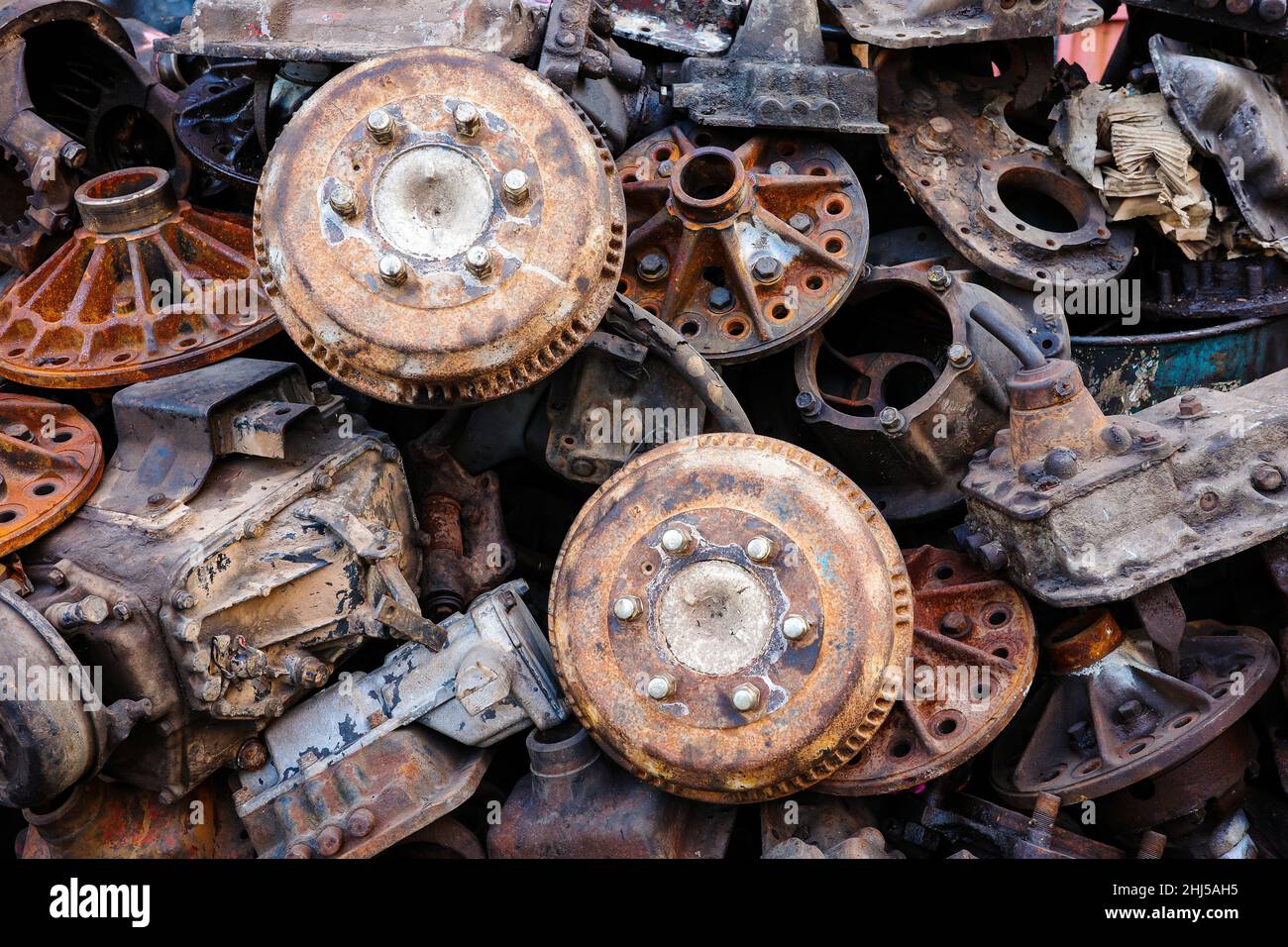Pile of rusty and dirty obsoleted old vehicle metal engine and spare ...