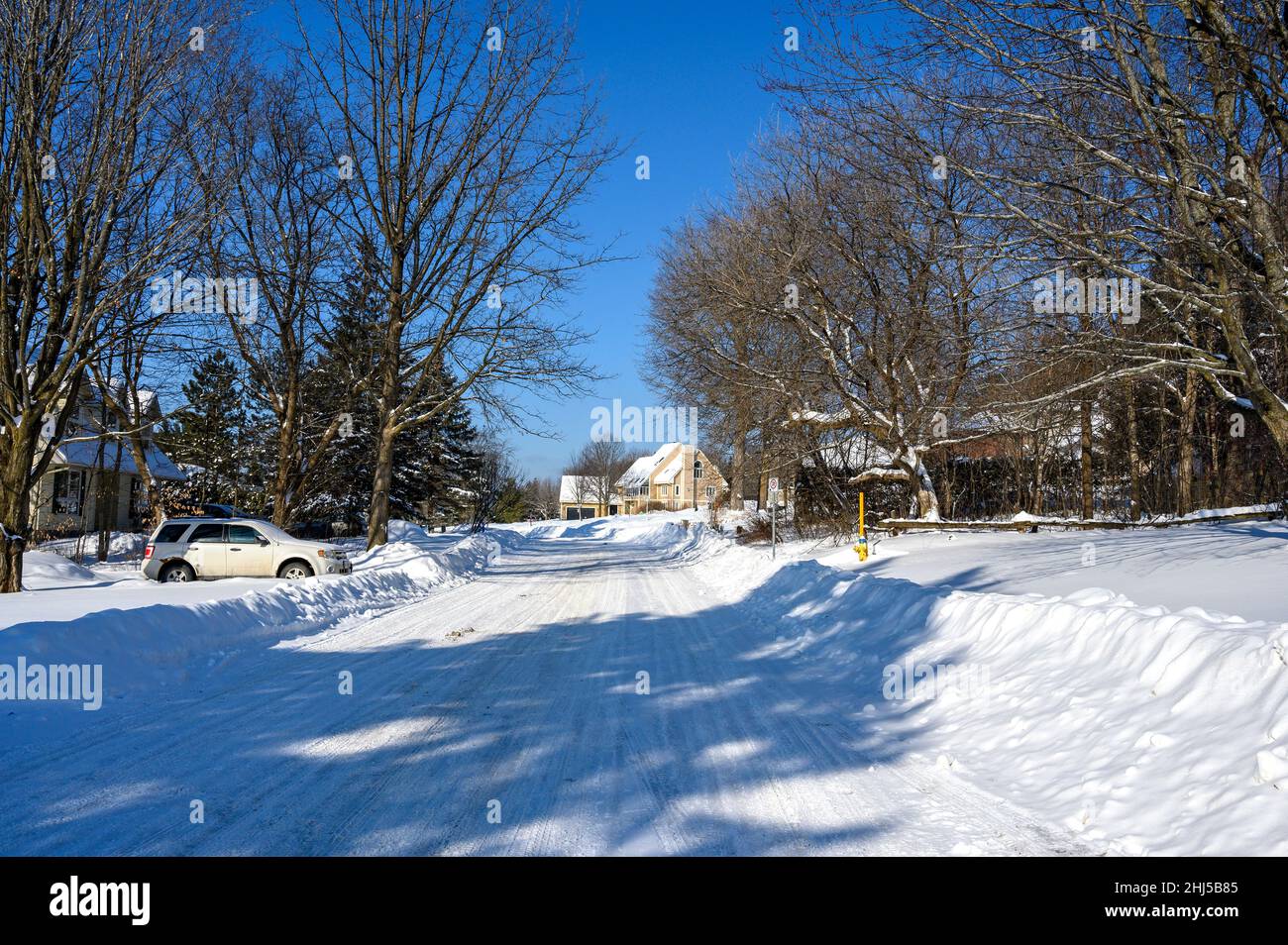 suburban street after the snow storm Stock Photo - Alamy