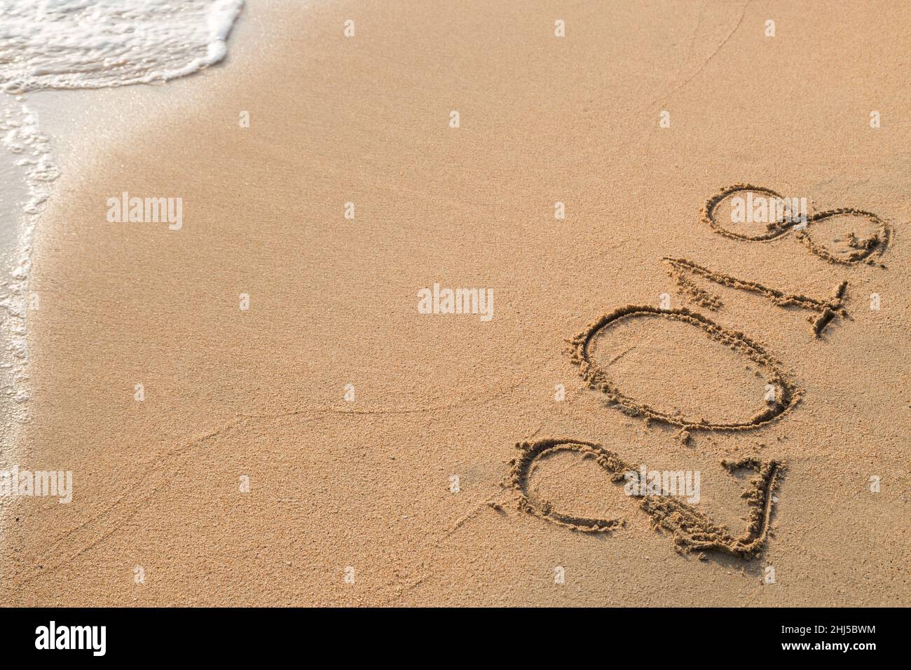 2018 message written in the sand at the beach background Stock Photo ...