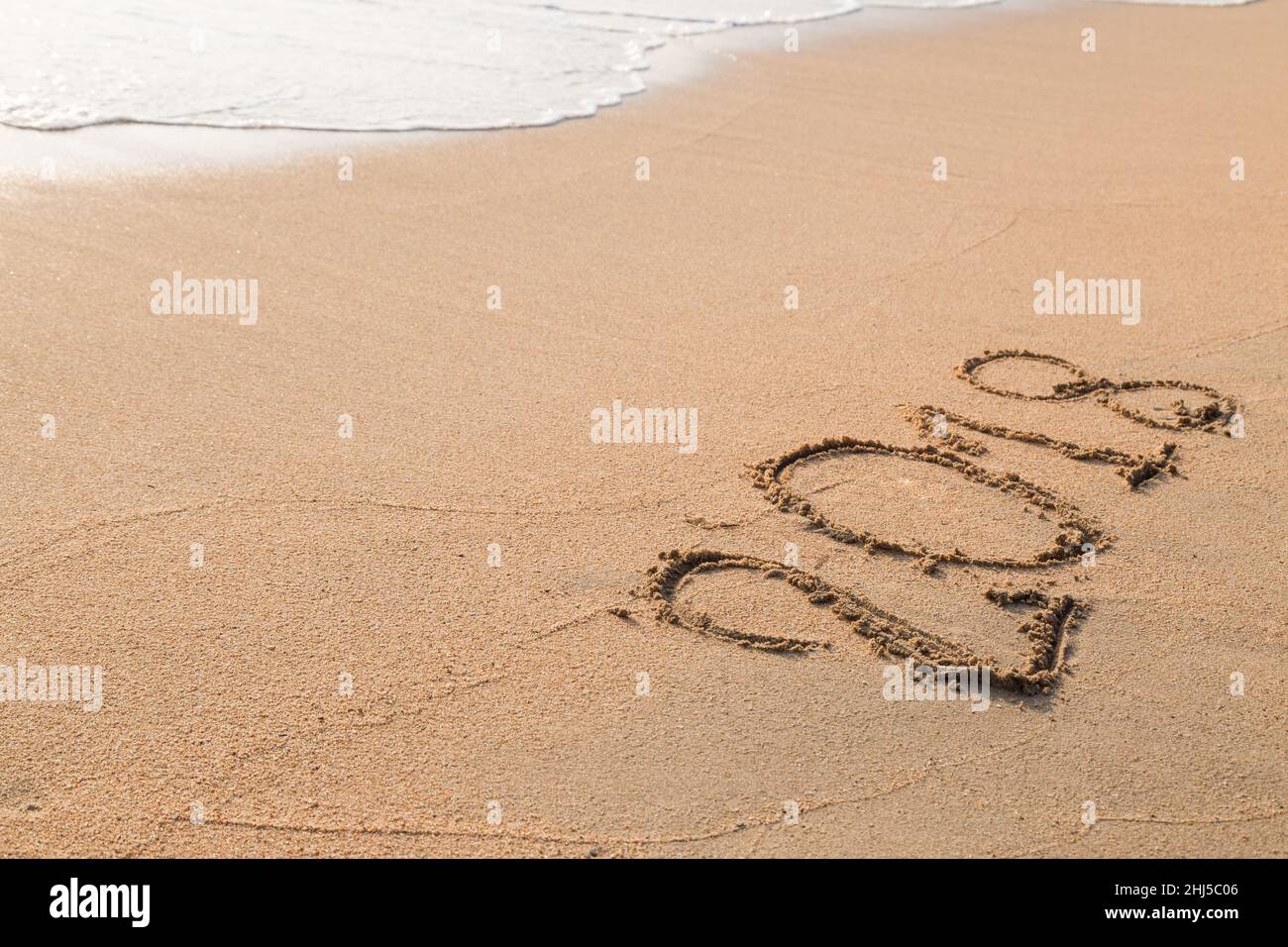 2018 message written in the sand at the beach background Stock Photo ...
