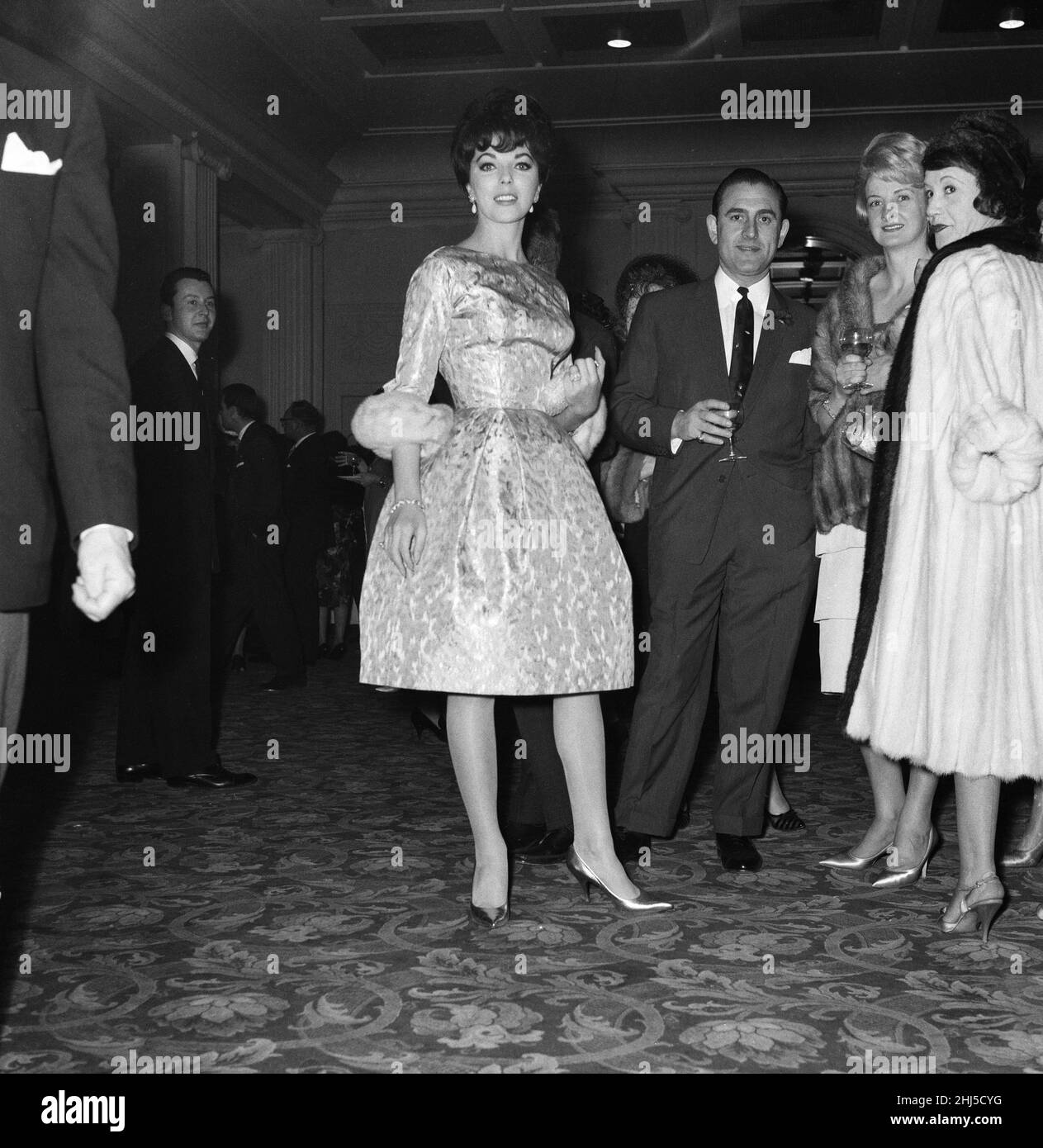Joan Collins attends the wedding of Jackie Collins and Wallace Austin ...