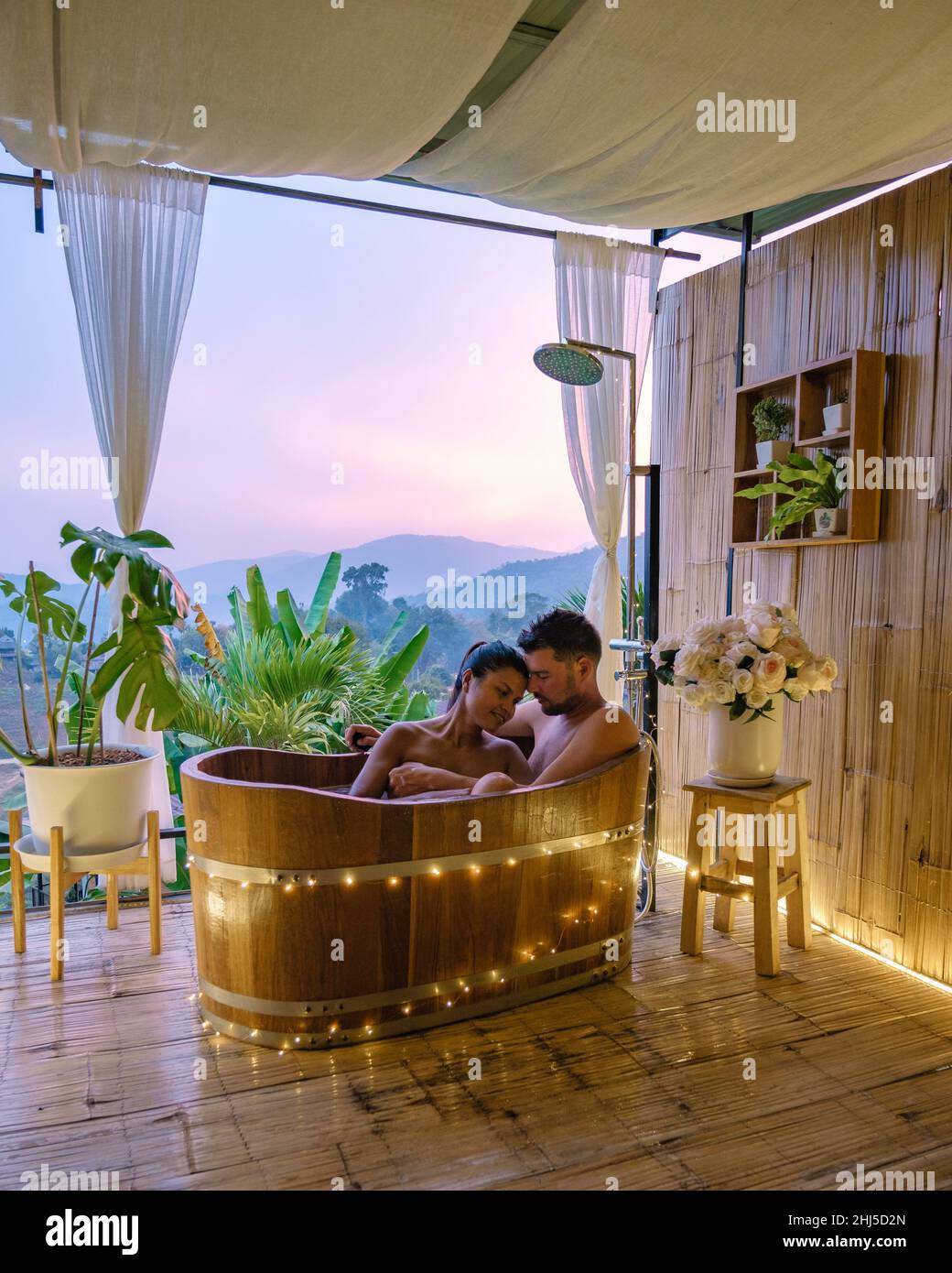 Bathtub during sunset in the mountains of Chiang Mai Thailand, relaxing ...