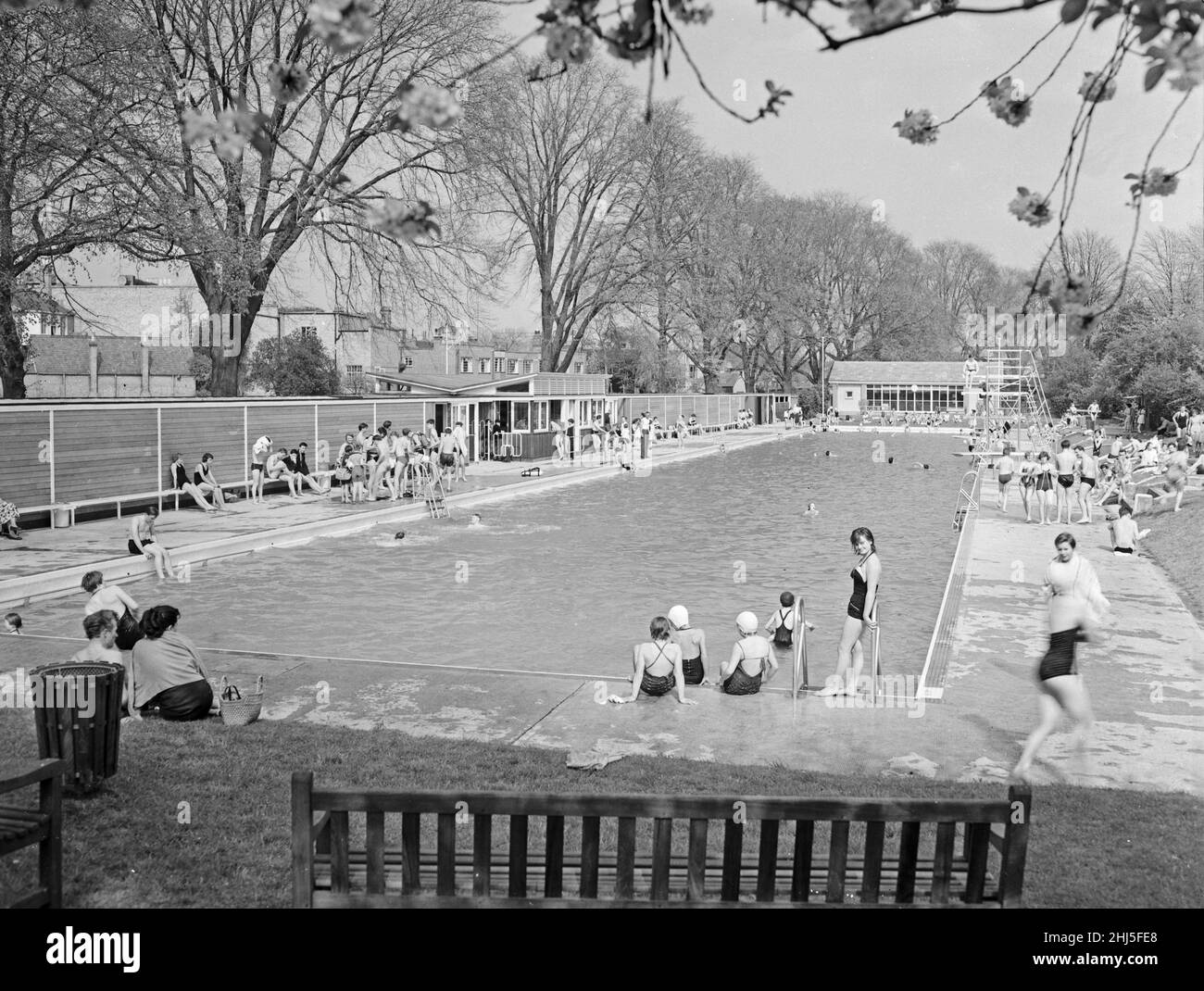 Young people enjoying the warm spring time sunshine at the Jesus Green ...