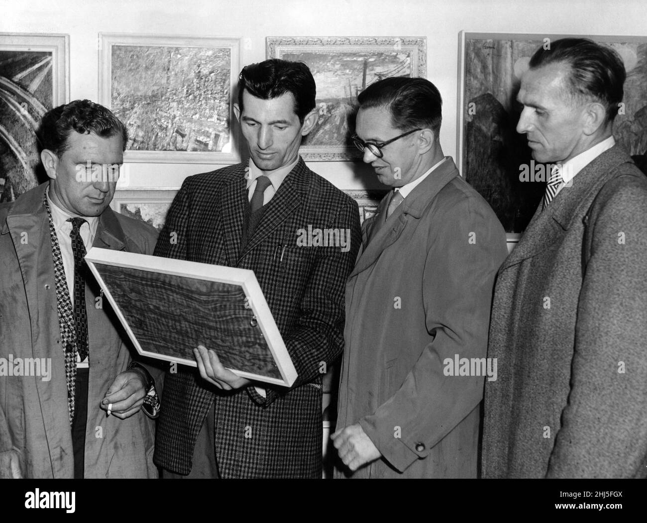 Three German miners admire the work of Norman Cornish, the Durham miner ...